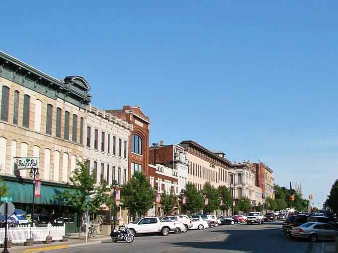 Tree-lined boulevards stretch toward historic buildings, creating postcard views that change beautifully with every passing season.