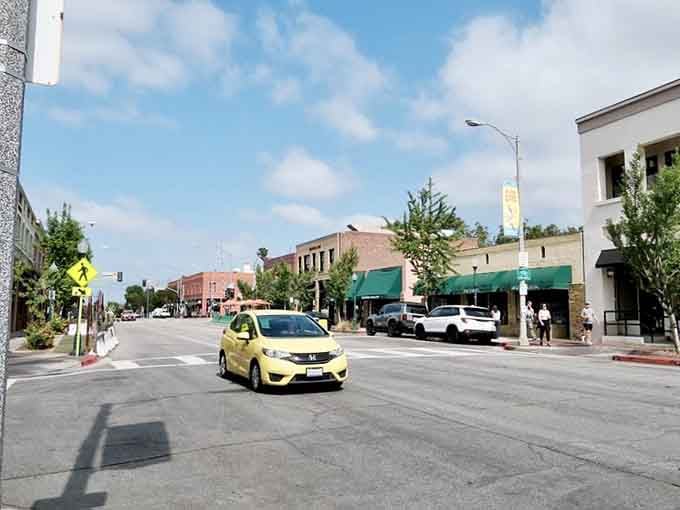 Wide streets and green awnings welcome visitors to a downtown where parking is easy and stress is optional.