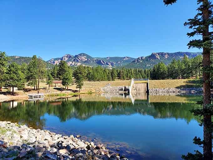 Crystal-clear reflections of mountain peaks dancing on the water's surface create double the beauty for free.