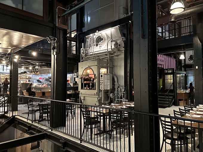 Inside this industrial cathedral, massive boilers loom overhead while guests feast below in beautifully repurposed history come alive.