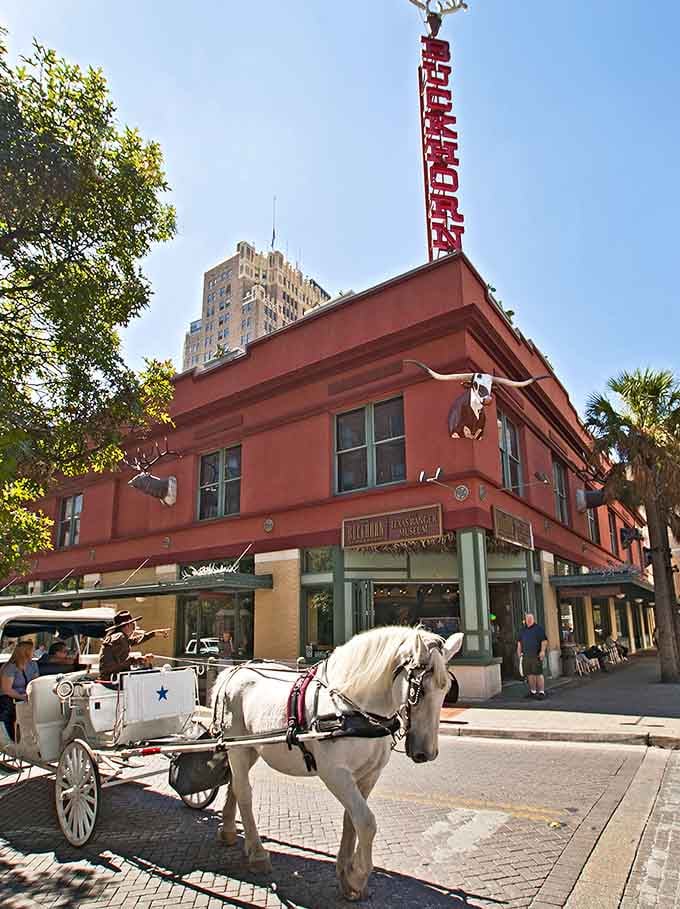 The horse-drawn carriage passing by adds authentic charm to this historic corner that time graciously forgot to change.