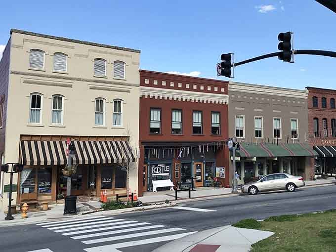 Striped awnings and pristine storefronts line up like a Norman Rockwell painting come to life in brick.