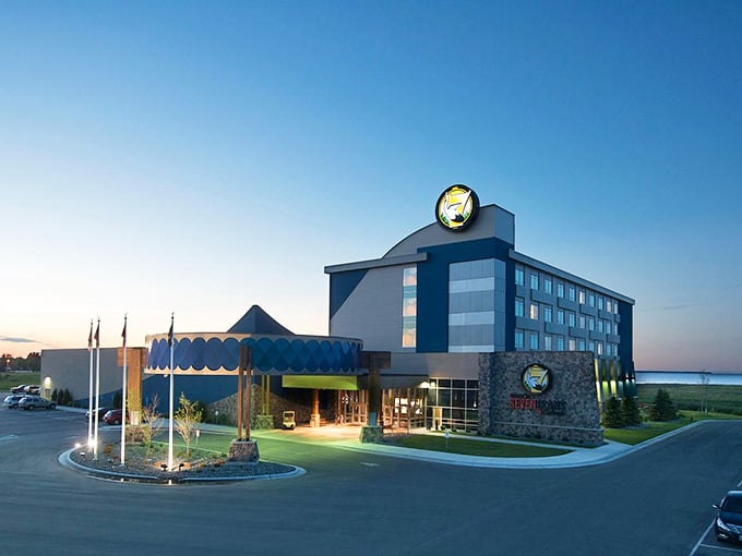 That striking blue-and-white hotel rises from the prairie like an oasis, promising comfort after long northern journeys.