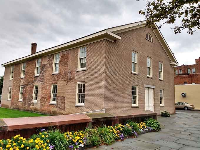 The restored brick building stands dignified, its windows reflecting light on a movement that illuminated half the population's future.