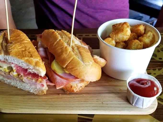 A Cuban sandwich and a bucket of tots, the kind of lunch that makes the afternoon feel very manageable.