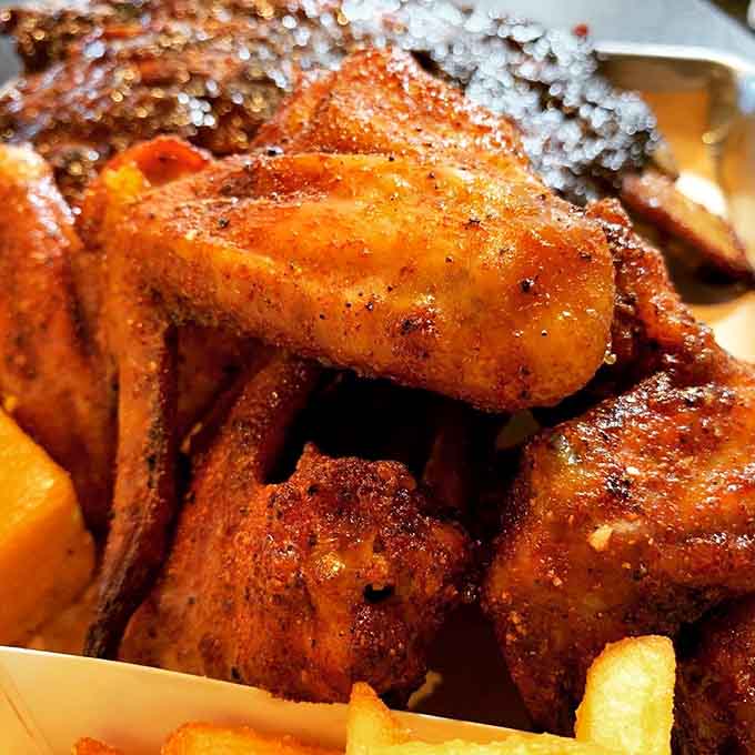 Golden-brown smoked wings glisten with flavor, proving that everything benefits from time in the smoker.