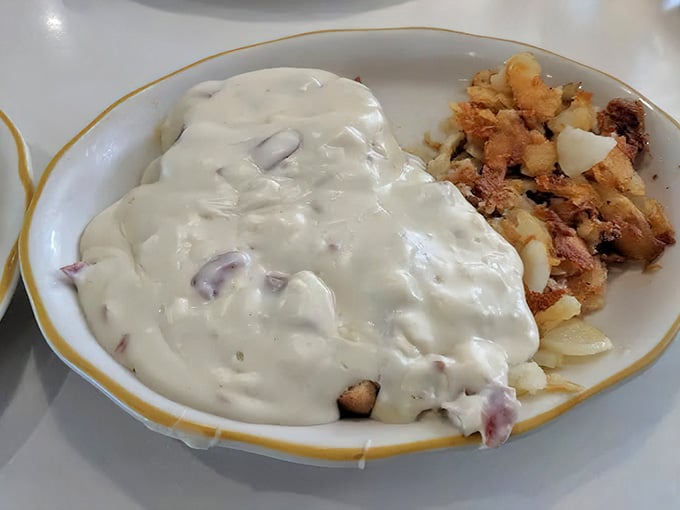 When gravy flows this generously over perfectly crisped potatoes, you know someone in that kitchen truly cares.