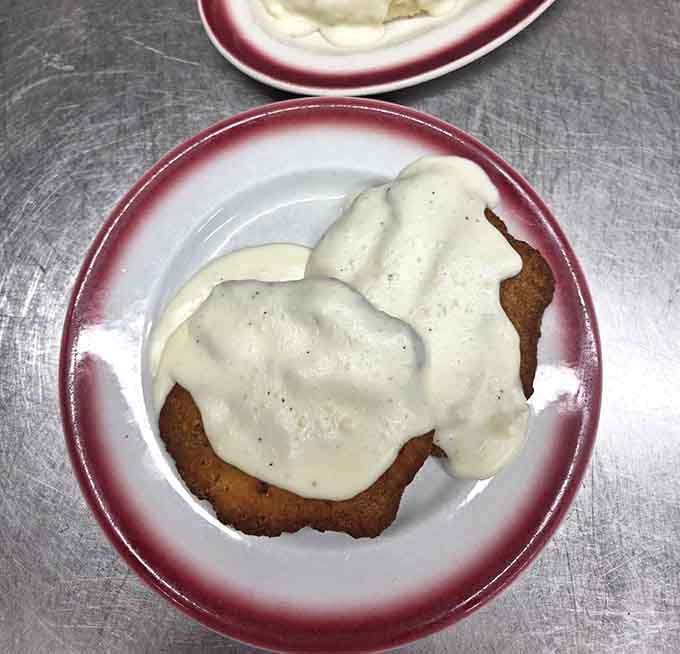 Country fried steak smothered in gravy, the kind of comfort food that gives comfort food a good name.