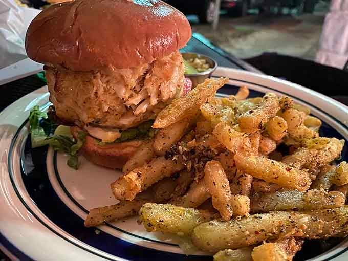 The crab cake sandwich celebrates Maryland's seafood heritage with generous portions and perfectly seasoned fries alongside.
