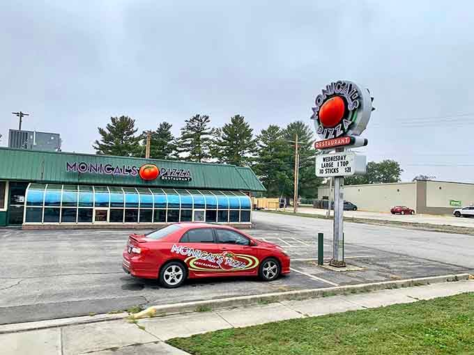 That vintage Monical's sign is practically begging you to stop for pizza and nostalgia in equal measure.