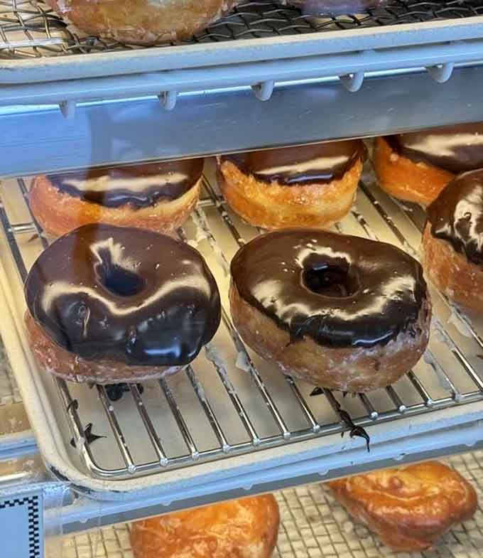 Chocolate-glazed beauties and their sour cream cousins, proving that variety really is the spice of donut life.