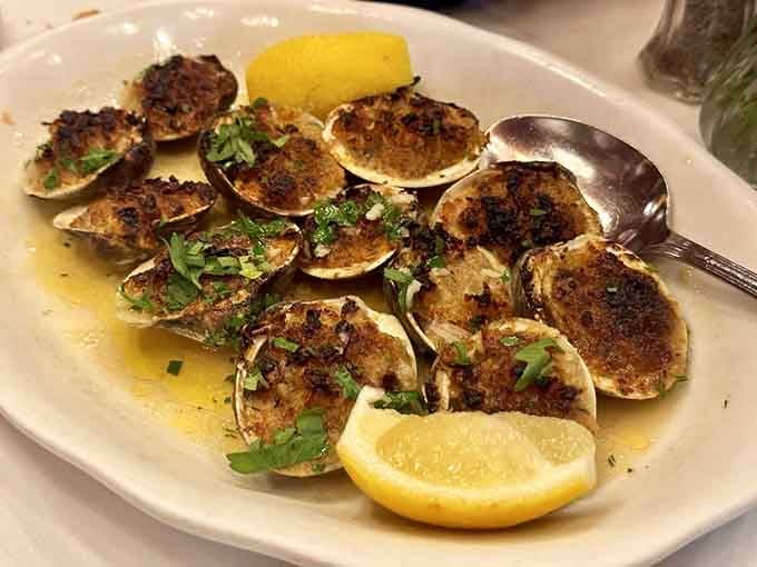 Baked clams oreganata that deliver the perfect marriage of briny seafood and savory breadcrumb topping in every bite.