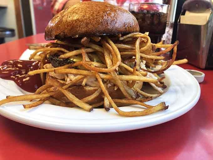 When your burger comes wearing a pile of fries like a hat, you know it's serious.