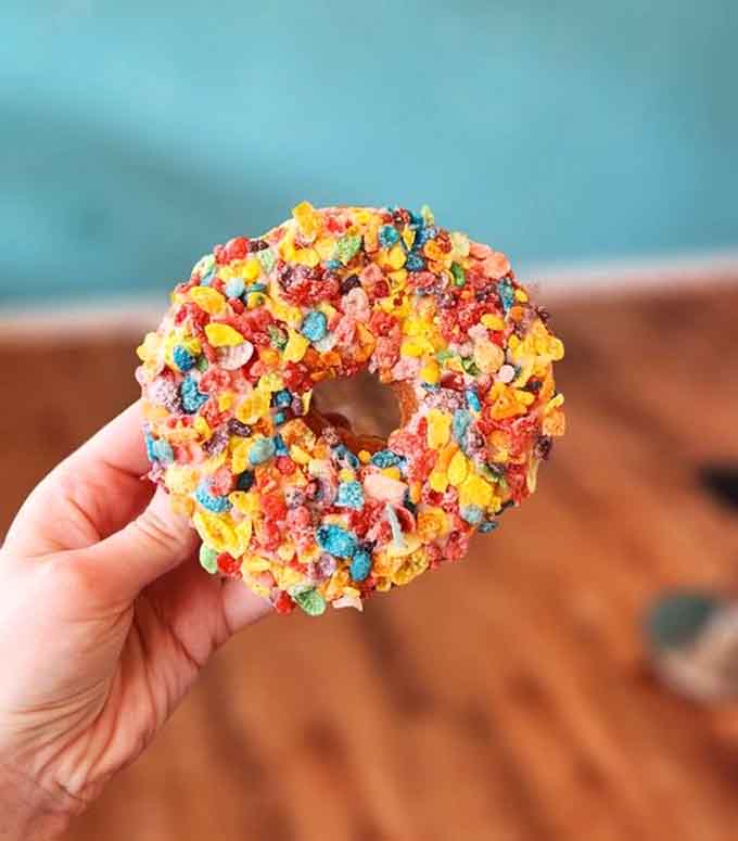 Fruity Pebbles coating transforms this donut into childhood nostalgia you can actually eat and enjoy.