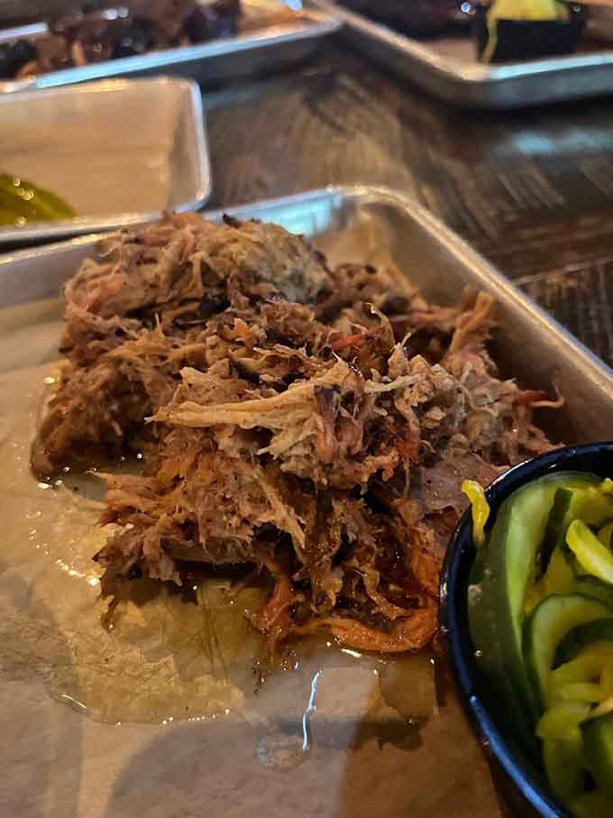 Pulled pork so tender it barely holds together, glistening with rendered fat and ready to make any sandwich legendary.