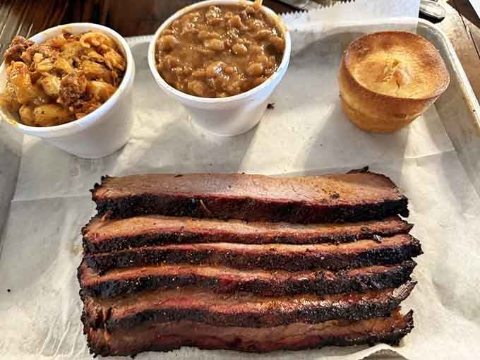 Brisket sliced thick with bark so dark it's practically black, the hallmark of patience and proper smoking.