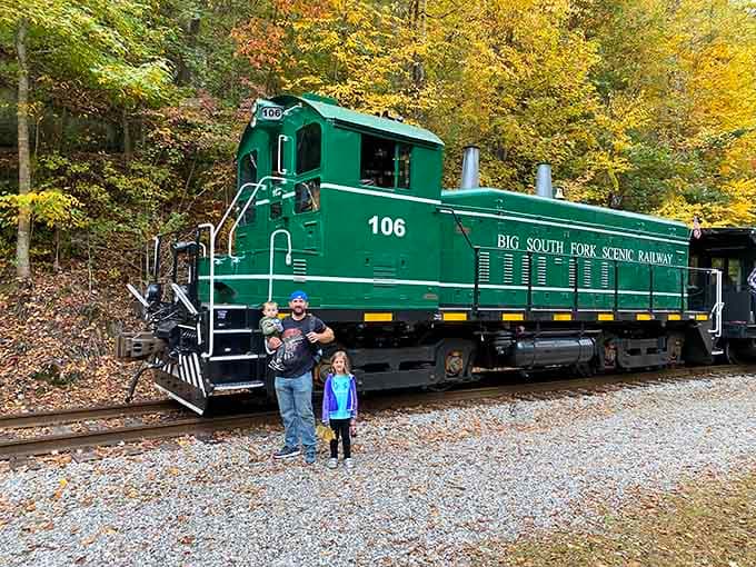 Autumn colors and a green locomotive create the kind of family photo that actually deserves a spot on the mantel.