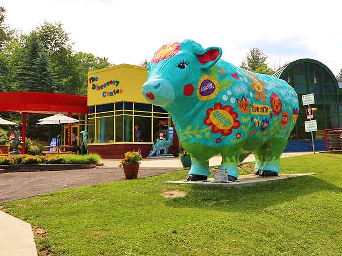 That turquoise cow is having way more fun than any bovine has a right to have.