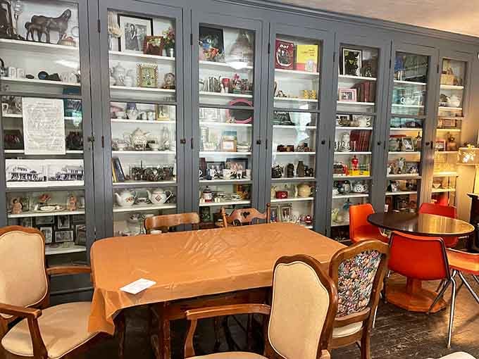 A curated collection of treasures and trinkets fills the shelves, offering visitors a chance to browse before descending into darkness.
