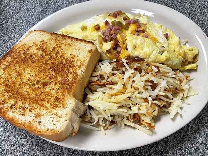 A Western omelet this loaded with hash browns and toast is basically breakfast's greatest hits album on one plate.