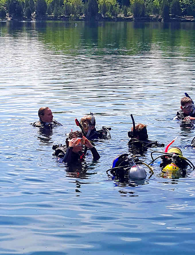 Scuba divers exploring these depths discover a whole different world lurking beneath that glassy surface.
