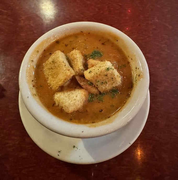 Tomato soup with croutons floating like little flavor rafts, warming souls one spoonful at a time.