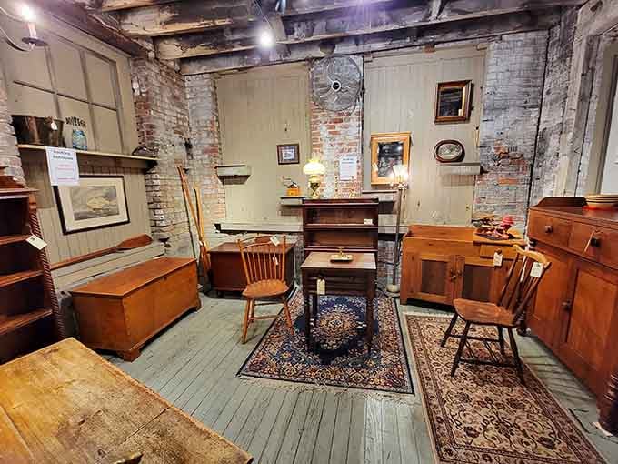 Exposed brick and weathered wood create the perfect backdrop for furniture that's seen more decades than most of us.