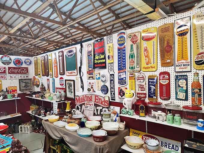 That wall of vintage advertising signs is basically a time machine to when Nehi and Royal Crown ruled the soda fountain.