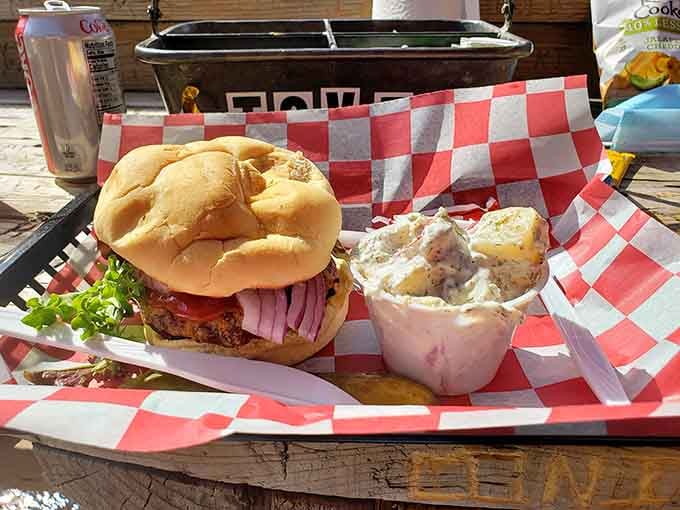 When your burger comes with homemade potato salad and sits on a checkered basket, you know someone's doing lunch right.