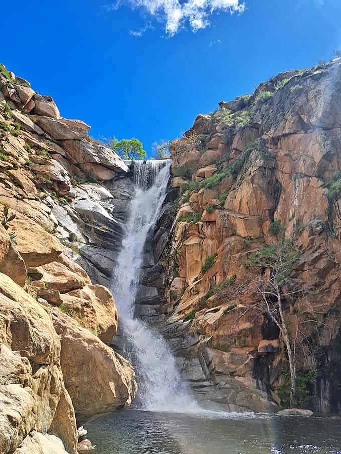 The waterfall roars down the cliff face with enough power to make your daily problems seem refreshingly insignificant and far away.
