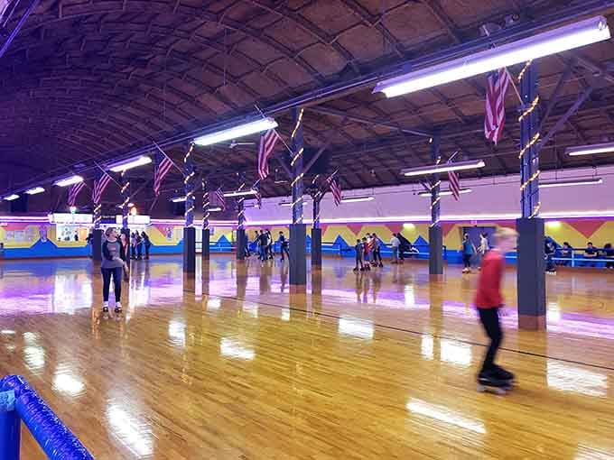 The roller rink's polished wooden floor gleams under colorful lights, ready for another generation to discover the joy of wheels.