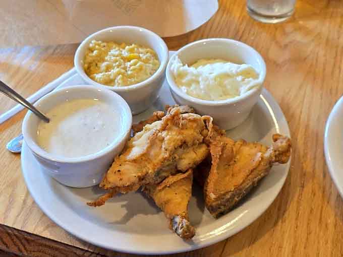 Fried chicken so perfectly golden it practically glows, accompanied by sides that deserve their own fan club.