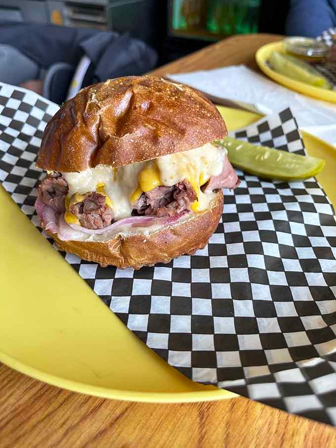 This London Broil creation proves that sometimes the best things come on a pretzel bun with melted cheese.