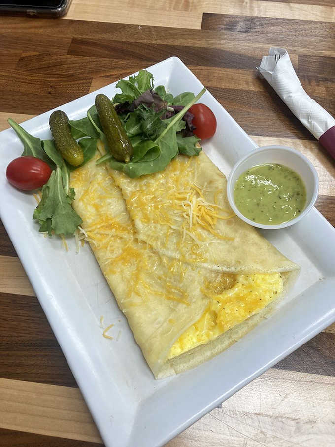 Fluffy scrambled eggs wrapped in a golden crepe with fresh greens, because savory crepes deserve equal billing here.