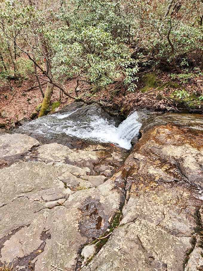 Water finds its way over layered rock like it's been doing this for millions of years, which it has.