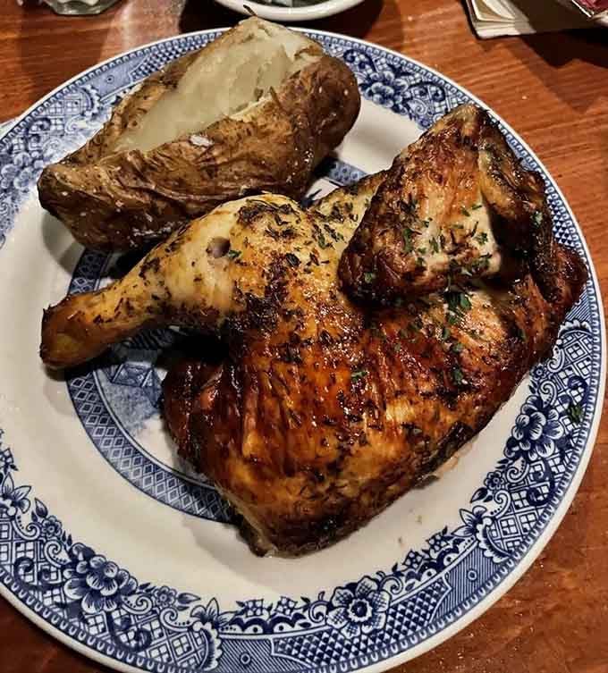 Spit-roasted chicken that's golden, juicy, and served with a baked potato bigger than your fist.