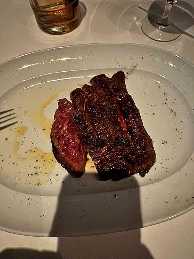 A ribeye cooked to rosy perfection, sliced and ready to remind you why steak will never go out of style.