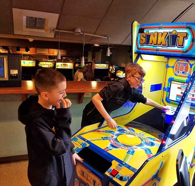 Young players discovering the magic of physical games, their concentration proving that good gameplay never goes out of style.