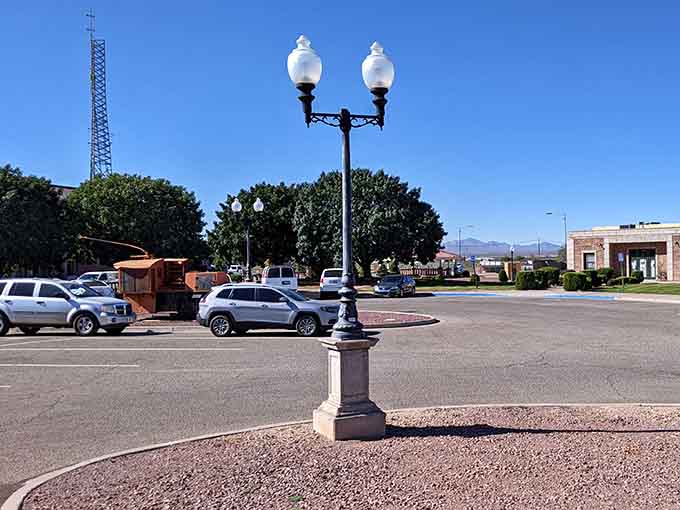Vintage street lamps stand sentinel over quiet intersections where rush hour is more suggestion than reality.