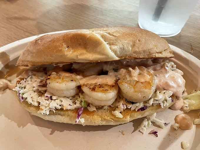 That grilled shrimp po' boy is piled high enough to require an engineering degree to eat properly.