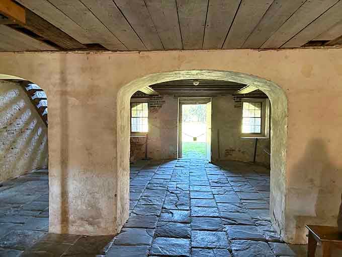 The cellar's arched doorways and stone floors reveal the practical genius behind raising houses in flood-prone Lowcountry.