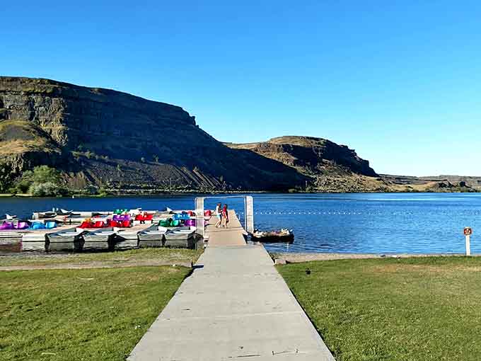 Colorful paddle boats line the dock, ready to explore lakes born from the planet's most violent tantrum.