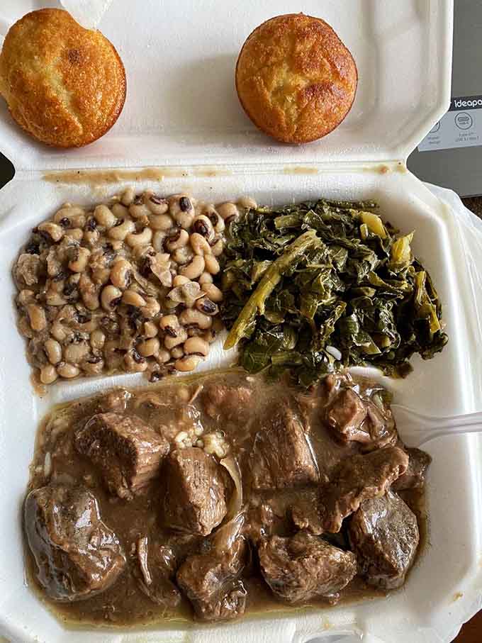 Beef tips nestled in gravy with candied yams glowing like edible sunshine, because sometimes life gets it right.