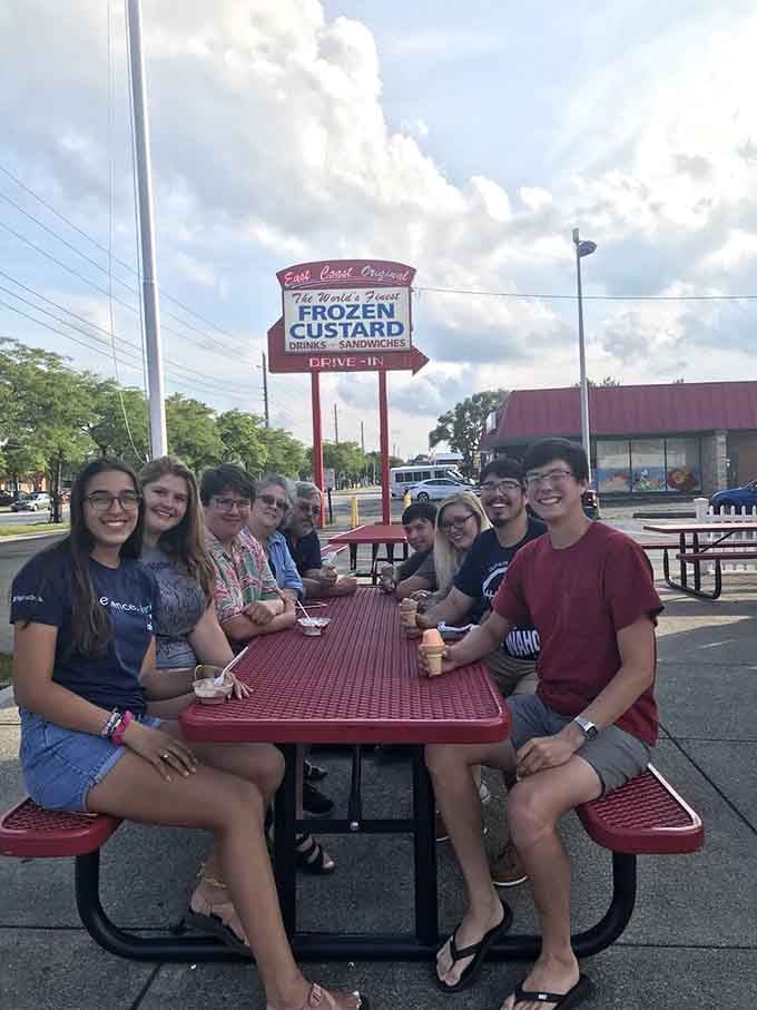 Groups of happy customers gathering at picnic tables is what summer evenings were invented for, honestly.