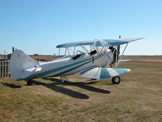 A vintage biplane at Katama Airpark reminds you that some adventures require leaving the ground entirely behind.