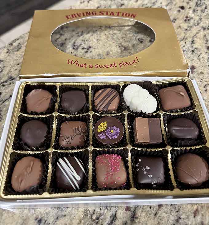 This golden box of assorted chocolates whispers "What a sweet place" while your willpower whispers back "I surrender."