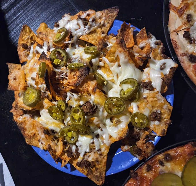 Nachos loaded with jalape&ntilde;os and enough cheese to make you forget you're not actually in a haunted house.