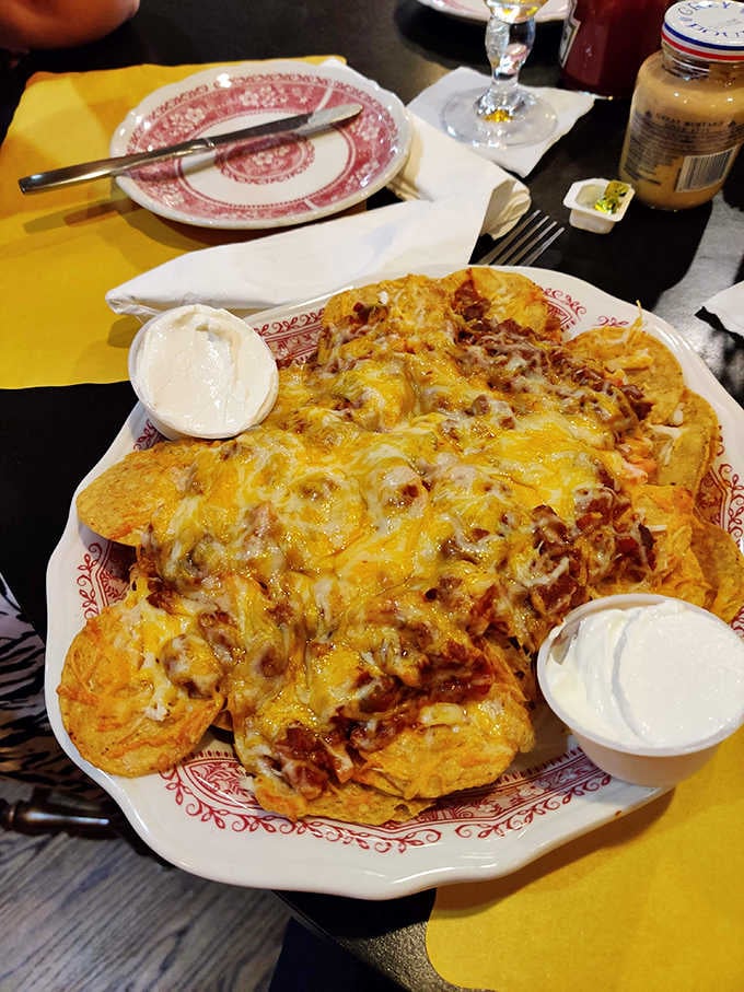 These loaded nachos are piled so high they could qualify as their own food group, cheese and all.