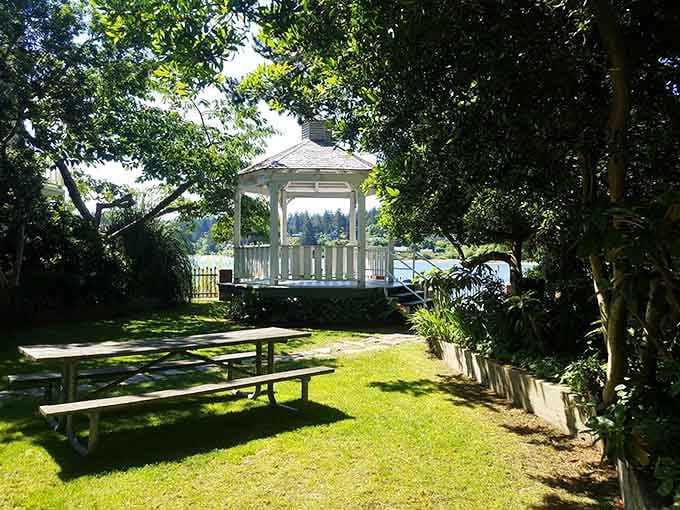 A white gazebo nestled among trees offers the perfect spot for summer concerts and marriage proposals alike.