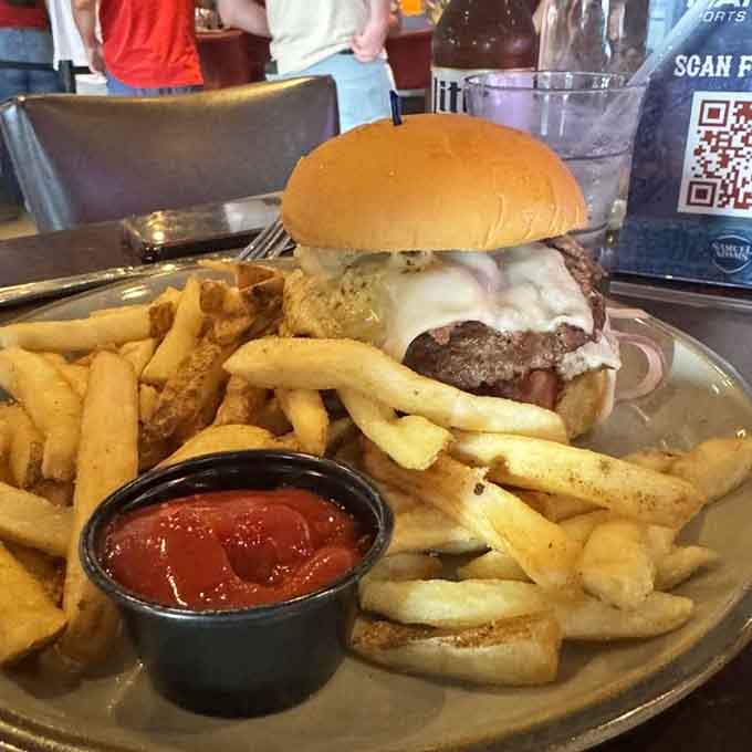 A juicy burger with melted cheese and crispy fries delivers comfort food perfection that never goes out of style.